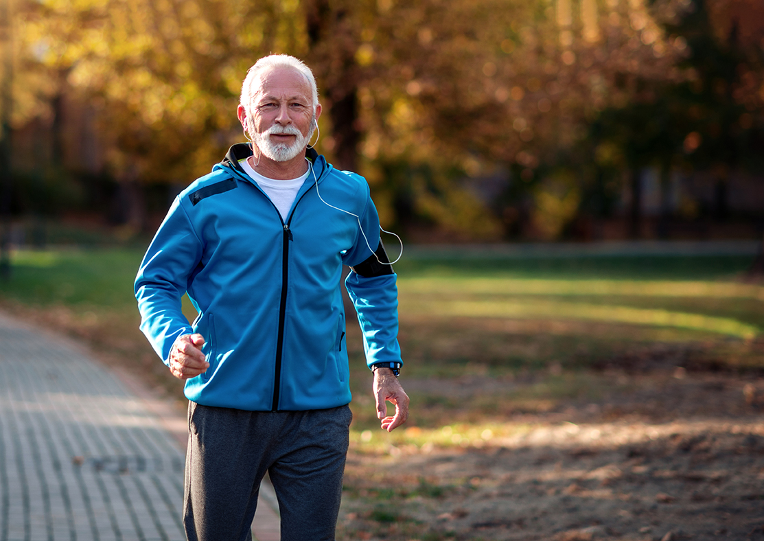 Active senior runner jogging outdoors - Lakeland Regional Health